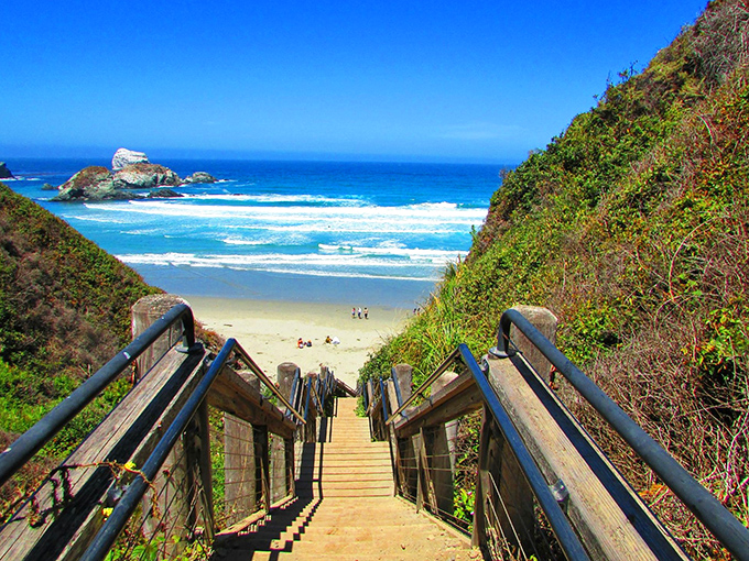 Wooden steps lead down to Hidden Beach, where nature has created the perfect stairway to paradise.