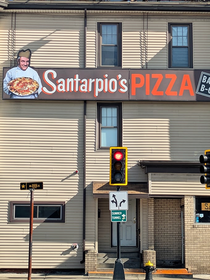 Santarpio's sign stands proud against the Boston sky &ndash; a beacon of pizza hope in East Boston.