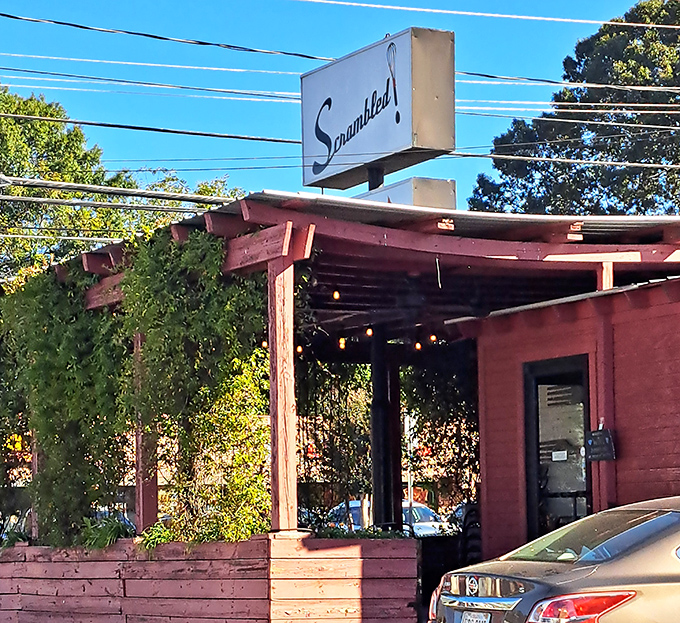 Scrambled's rustic red exterior and wooden pergola promise a Southern breakfast experience worth writing home about. Comfort with character!