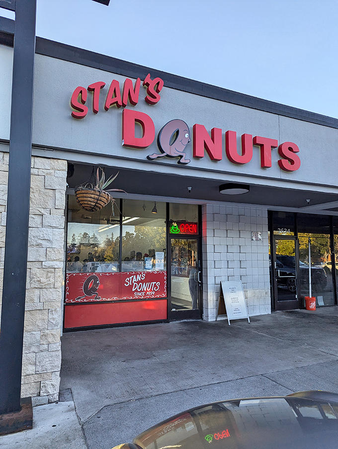 Stan's bold red sign has guided hungry donut seekers for generations. A beacon of fried dough excellence.