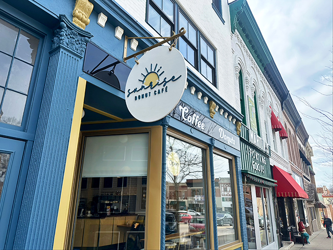 Sunrise Donut Caf&eacute;'s blue storefront adds a pop of color to Monroe's main drag. That hanging sign promises morning magic inside.