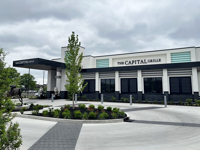 The Capital Grille's sleek design stands like a modern temple to beef, complete with equine guardian.