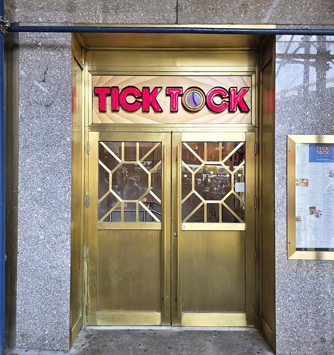 Tick Tock's golden entrance doors open to reveal Midtown's most reliable comfort food sanctuary.