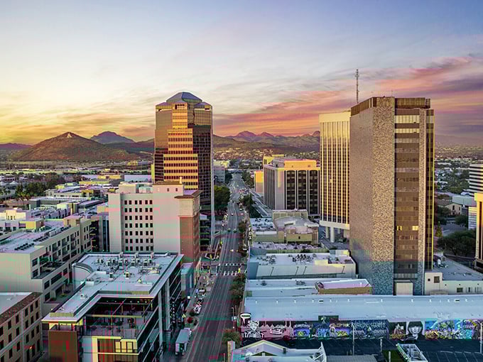 Tucson sprawls beneath an endless sky, where suburban streets reach toward distant mountains like fingers stretching for something magnificent.