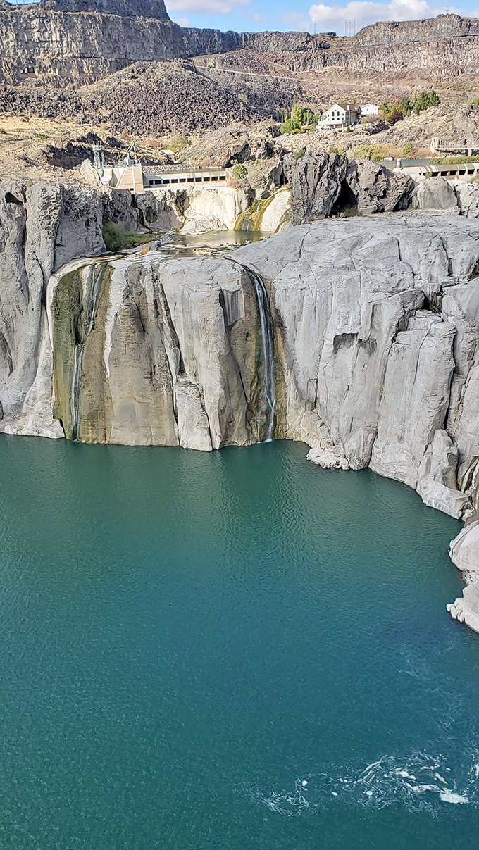 Twin Falls&mdash;nature&rsquo;s hidden gem, where ancient cliffs meet tranquil waters, like a masterpiece still unfolding.
