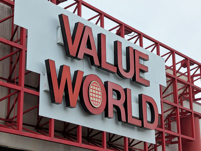 Value World's bold red signage promises exactly what it delivers&mdash;a world of values waiting to be discovered by patient explorers.