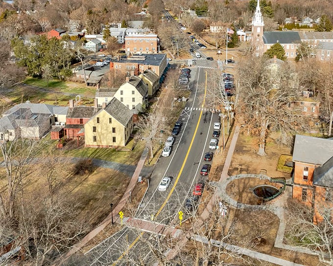 Historic colonial homes line quiet streets where your retirement budget buys genuine New England charm affordably.