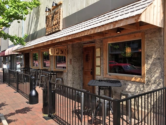 Wildwood Tavern's rustic wooden facade suggests you've found a place where comfort food meets comfort atmosphere.
