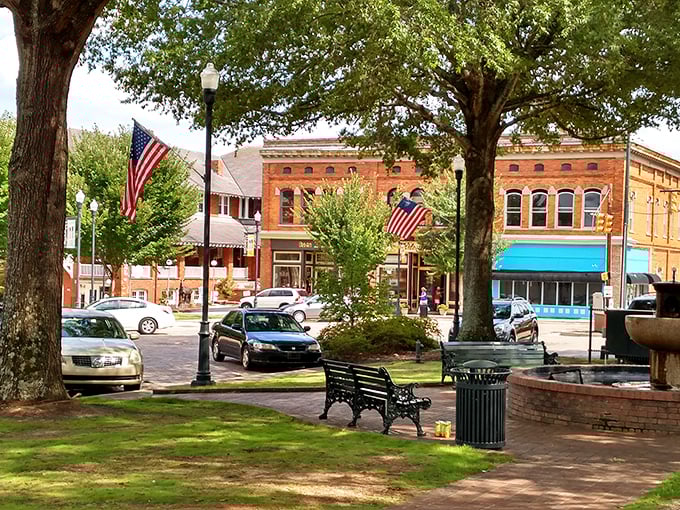 Historic buildings frame Abbeville's central monument like a living history book. Those park benches are practically begging you to sit a spell.