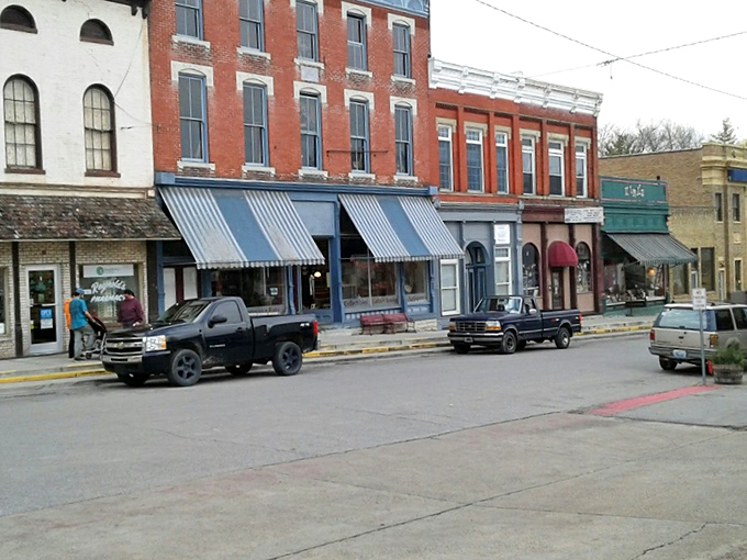 These storefronts stand like old friends catching up, each one with its own story to whisper.