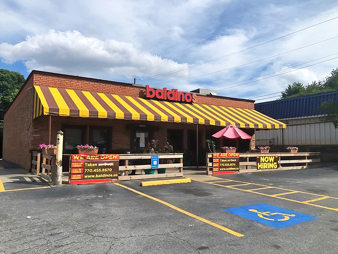 That bright yellow awning signals good times and even better sandwiches await hungry customers inside.
