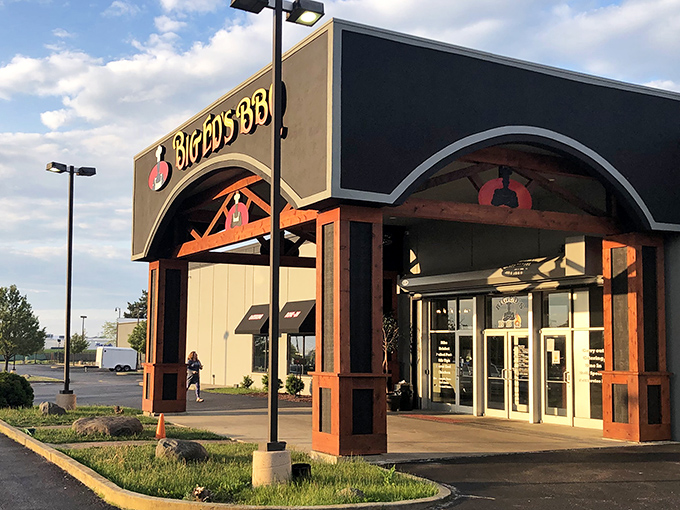 The wooden beams framing Big Ed's entrance are like nature's way of saying, "Seriously good barbecue happens here."