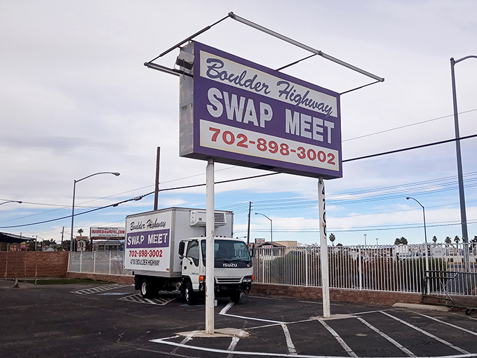 Purple signage stands proud against desert landscape like a beacon calling all treasure hunters to their happy place.