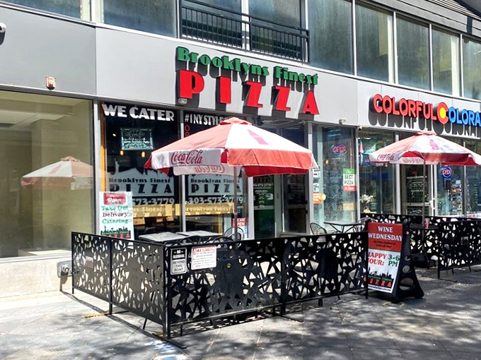 Red umbrellas and sidewalk seating bring Brooklyn's finest pizza tradition to Colorado's urban heart.