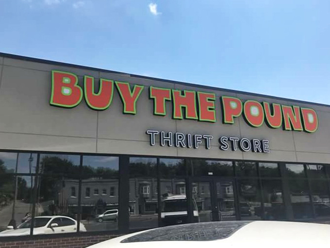 The bold green and red signage promises a different kind of thrift adventure. Here, your bargains are measured by the pound, not the piece.