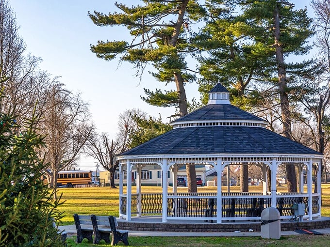 A gazebo straight out of a Norman Rockwell painting&mdash;quiet charm, wooden benches, and stories waiting to unfold.