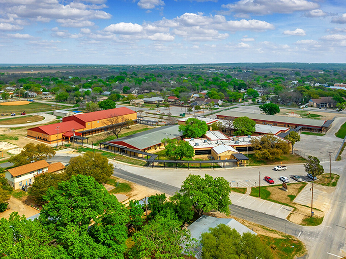 An aerial view of Castroville shows how the town nestles perfectly between the Medina River and rolling Hill Country terrain.