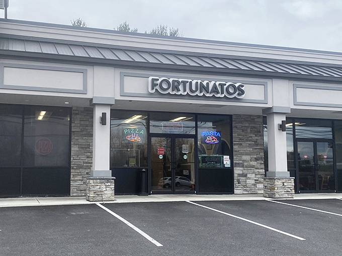 The neon "PASTA" sign might be visible, but trust me - it's the pizza that will have you planning your return.