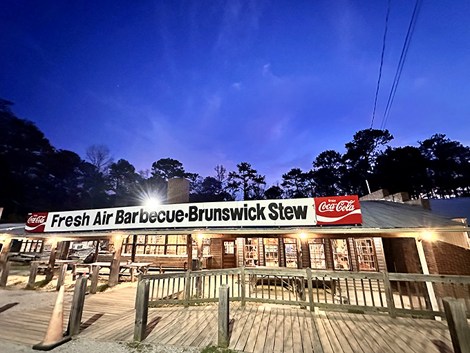 By day or night, that illuminated sign beckons like a barbecue lighthouse guiding you to smoky, porky treasure.