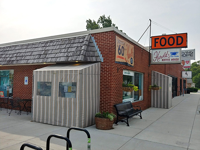 Classic brick and metal siding create the perfect backdrop for timeless American breakfast traditions.