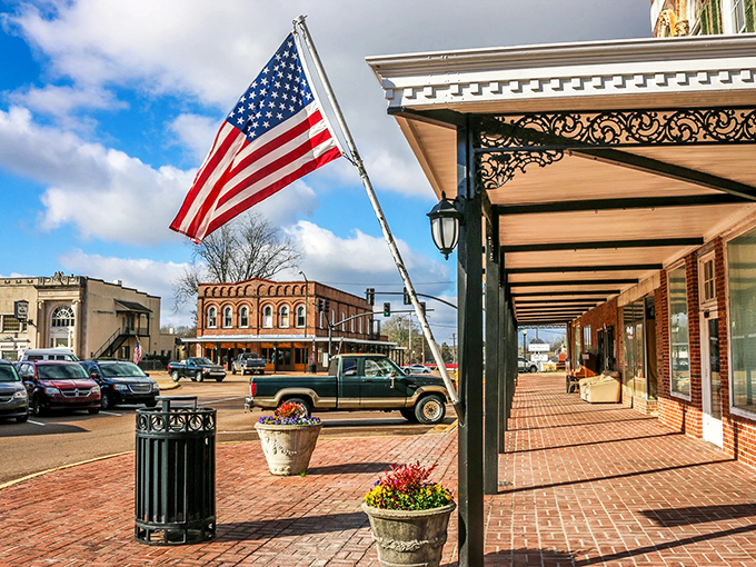 These storefronts stand shoulder to shoulder like old friends, their varied rooflines creating a Main Street silhouette worthy of a movie set.