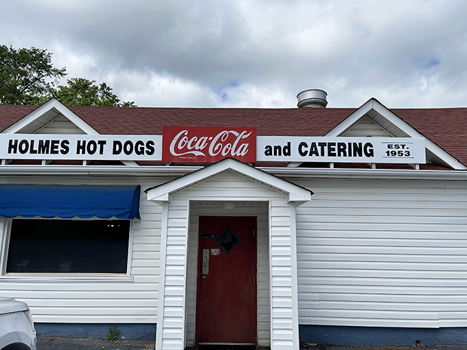 That Coca-Cola sign and simple white exterior tell you Holmes Hot Dogs doesn't need fancy frills when the food speaks volumes.