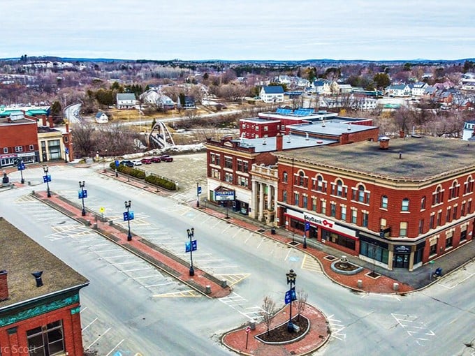 An aerial view of Houlton's historic downtown, showcasing its classic brick buildings and wide streets where affordable living meets small-town charm.