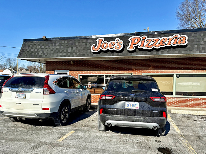 A busy parking lot tells the real story - this unassuming spot delivers serious pizza.