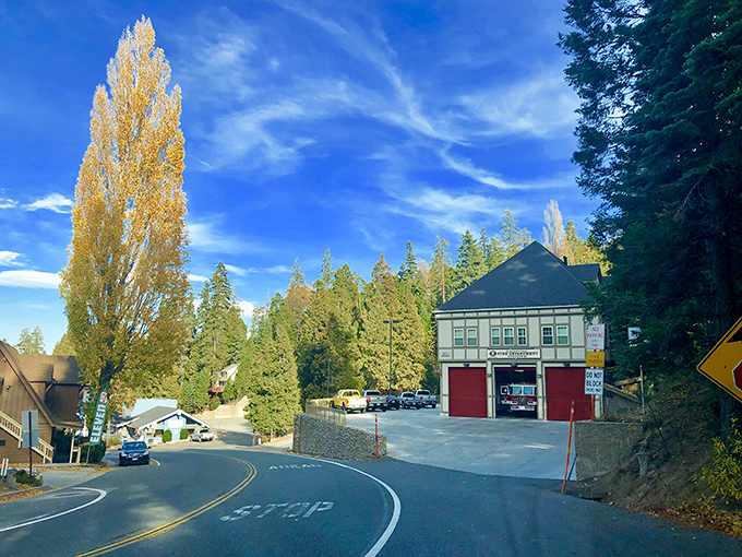 That classic mountain fire station with red doors stands ready to serve this tight-knit alpine community.