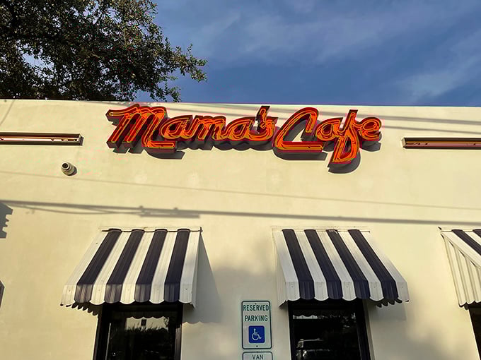 Black and white awnings frame a neighborhood institution where every meal feels like Sunday dinner with family. 