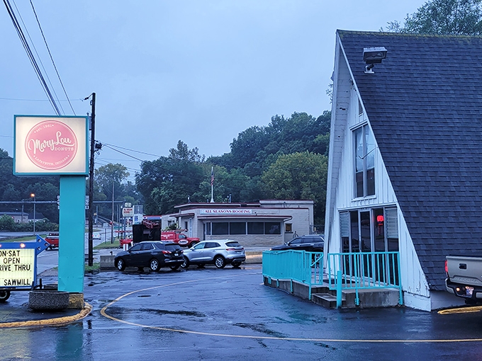 The charming A-frame of Mary Lou Donuts has witnessed countless morning pilgrimages. Its turquoise railings guide the faithful to sugary salvation.
