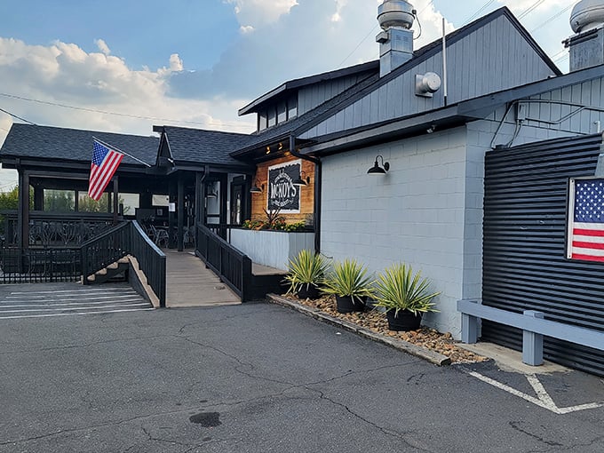 The American flags and blue-gray exterior of McKoy's Smokehouse blend patriotism with the serious business of barbecue.