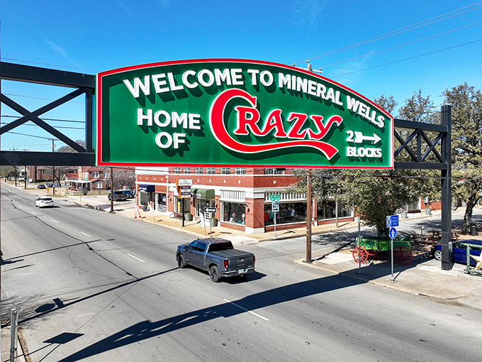 The "Home of Crazy" sign welcomes visitors to Mineral Wells, where the famous mineral water once drew health-seekers from across the country.