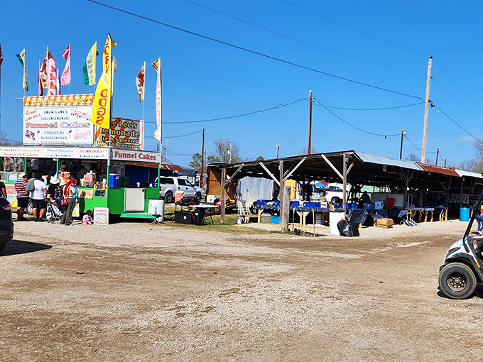 Tables overflow with jewelry, collectibles, and treasures that sparkle under the lights like tiny promises of great finds.