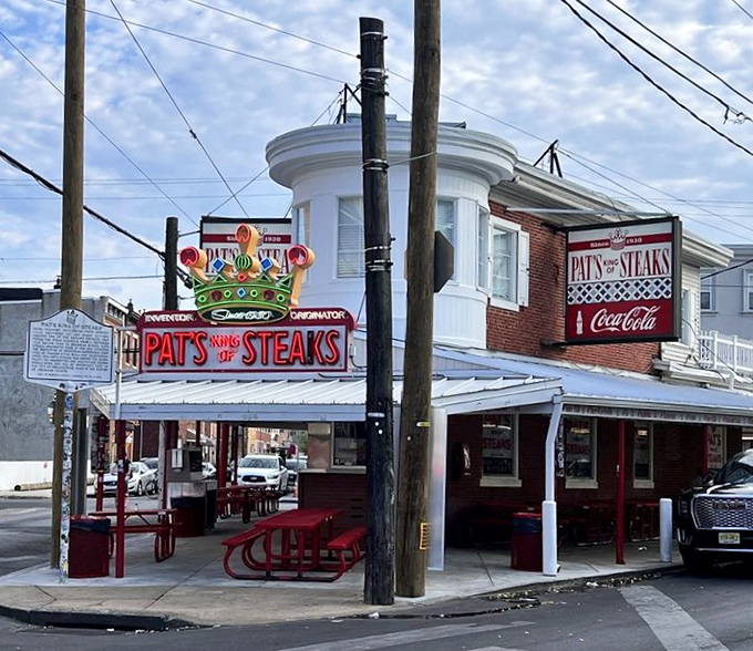 Where tourists and locals find common ground. The red and white awning has sheltered more food memories than your grandmother's kitchen.