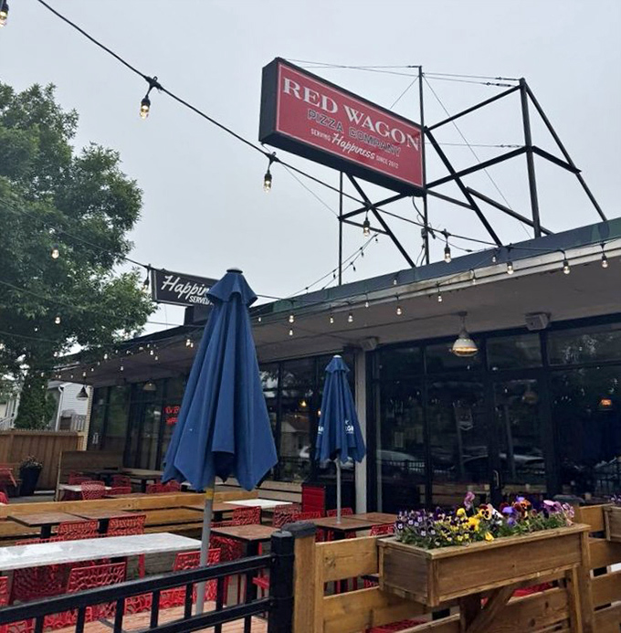 Those wooden tables and red chairs aren't just furniture &ndash; they're front-row seats to some of Minneapolis's finest pizza.