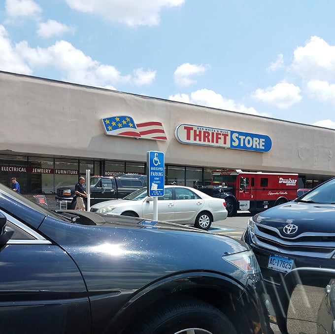 Sunshine illuminates the Red White & Blue storefront. Inside awaits a patriotic parade of pre-loved possibilities.