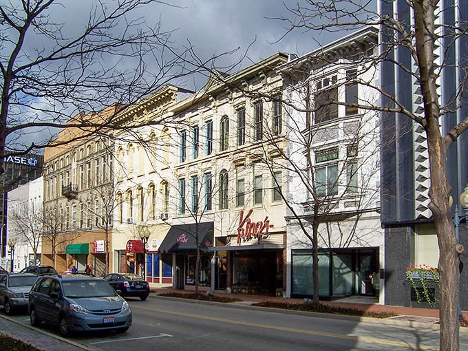 Historic buildings frame the street like old friends gathering for their daily dose of pleasant conversation.