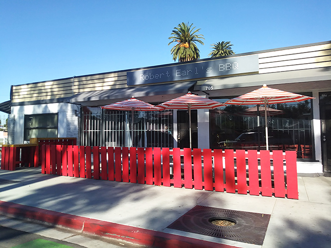 Sunshine, palm trees, and serious BBQ &ndash; Robert Earl's outdoor seating area invites you to linger over brisket.