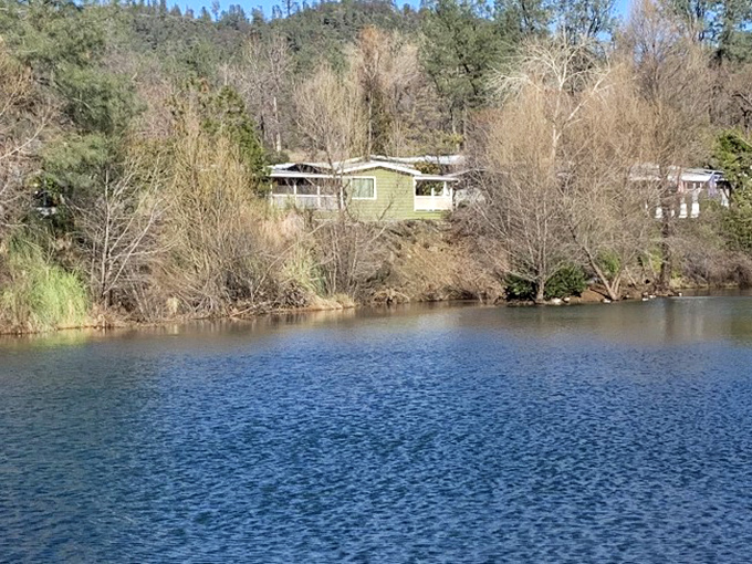 Waterfront solitude that won't sink your savings! This modest Shasta Lake cabin proves retirement dreams don't need marble countertops.