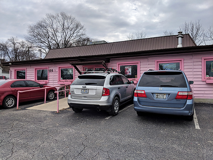 That wheelchair ramp ensures everyone gets to enjoy the smoky treasures inside this rosy BBQ paradise.