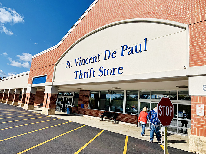 Two generations of thrift shoppers head inside, proving that treasure hunting truly spans all ages beautifully.