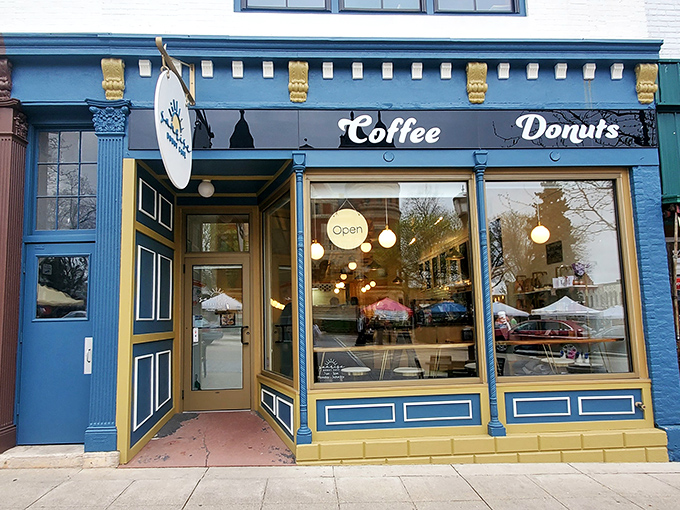 The charming blue and gold facade feels like it belongs in a storybook town. Coffee and donuts: the happiest of endings!
