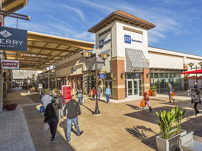 Modern architecture meets retail therapy, where covered walkways protect shoppers from Texas weather year-round. 