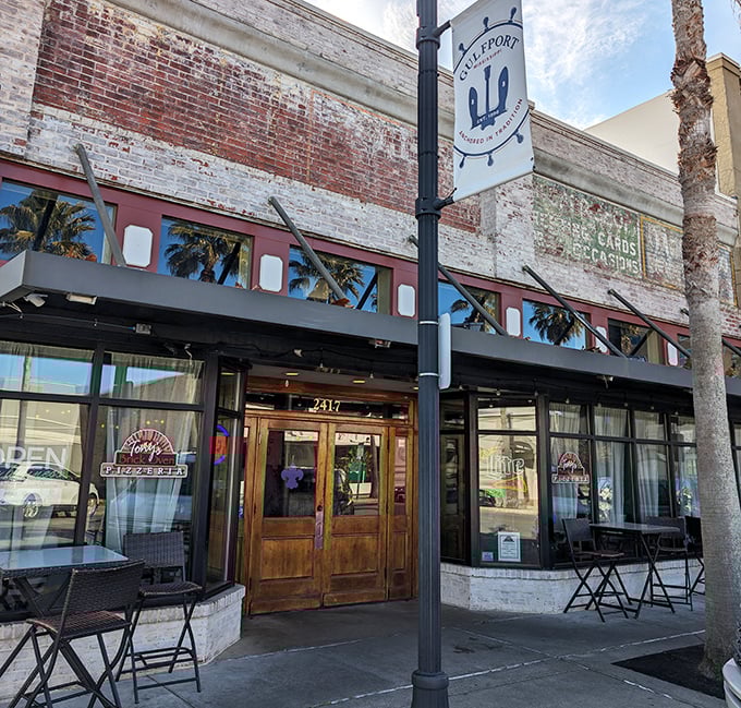 Behind these wooden doors lies pizza alchemy where fire meets flour in the most delicious way possible.