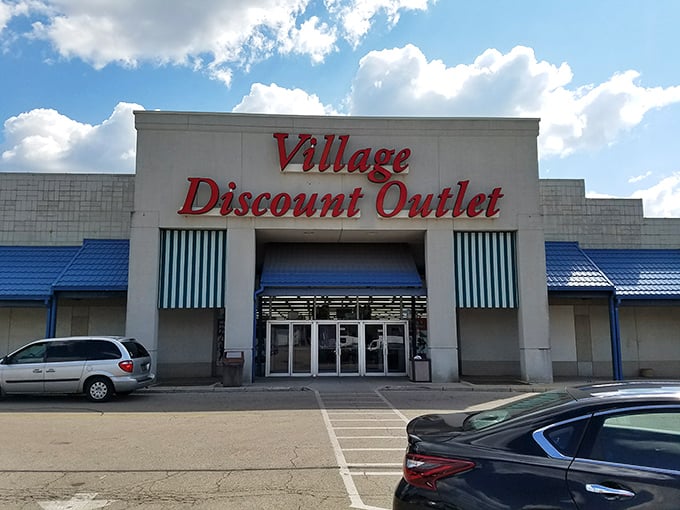 Blue awnings and clean lines promise organized chaos where every dig through merchandise yields surprising discoveries.