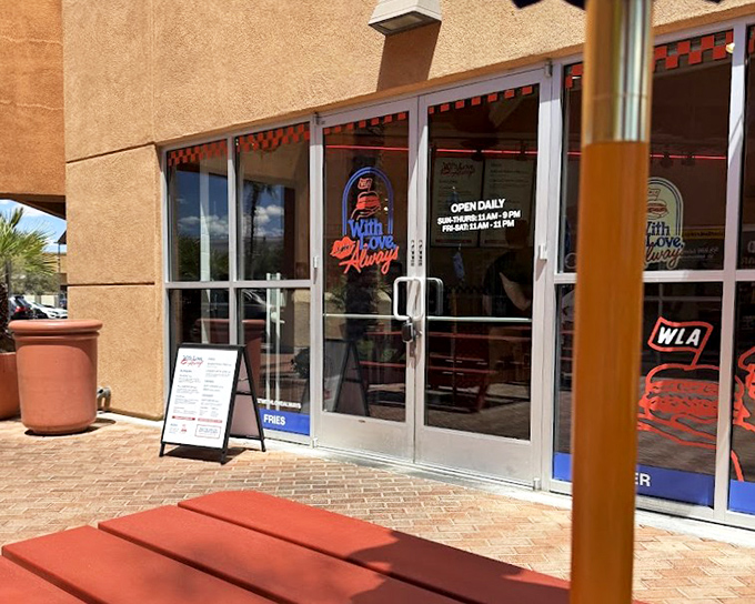 Neon signs glow through the windows of With Love, Always. Some of life's greatest pleasures hide behind the most modest doors.