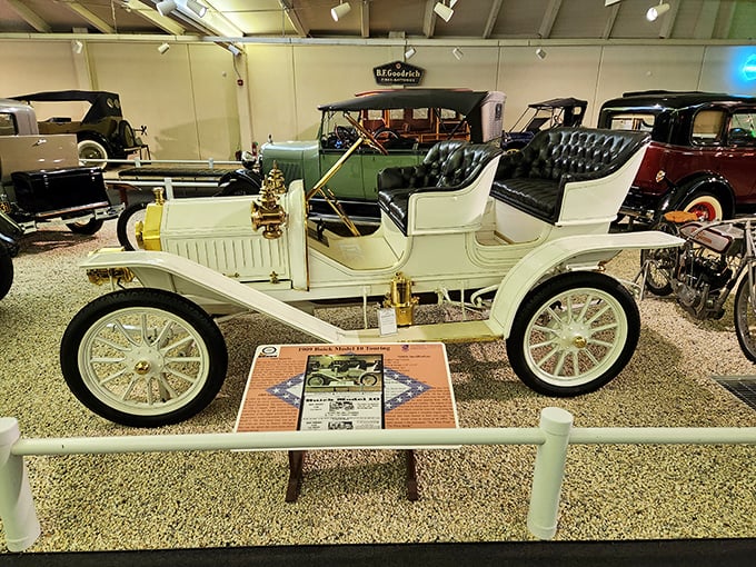 The pristine white 1909 Buick Model 10 Touring car represents an era when driving was an adventure and GPS meant "Get Passerby's Suggestions."