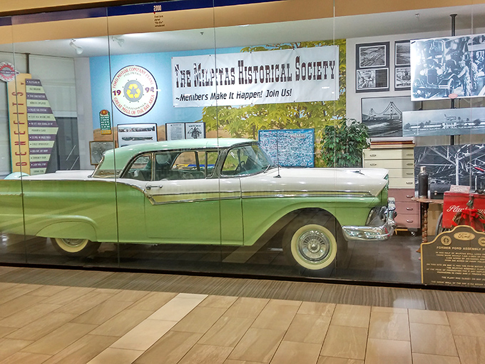 A vintage Ford Fairlane sits majestically behind glass, nodding to the mall's automotive past&mdash;from assembly lines to shopping lines.
