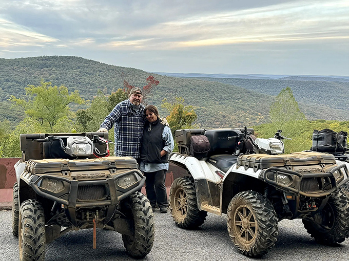 Adventure seekers pause at the overlook, their ATVs testament to another way to experience the rugged beauty surrounding the Pig Trail.